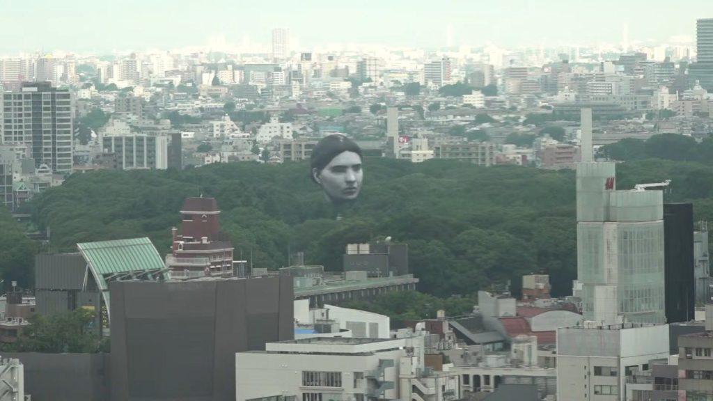 Giant Floating Head In Tokyo Looks Like The Colossal Titan From AOT